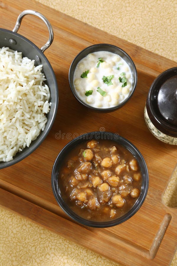 Chole Chawal or Chole Masala Rice with Raita, Indian Dish Stock Photo ...