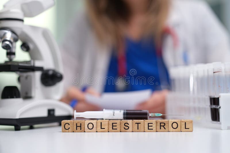 Cholesterol Testing in a Lab Using a Microscope and Test Tubes for ...