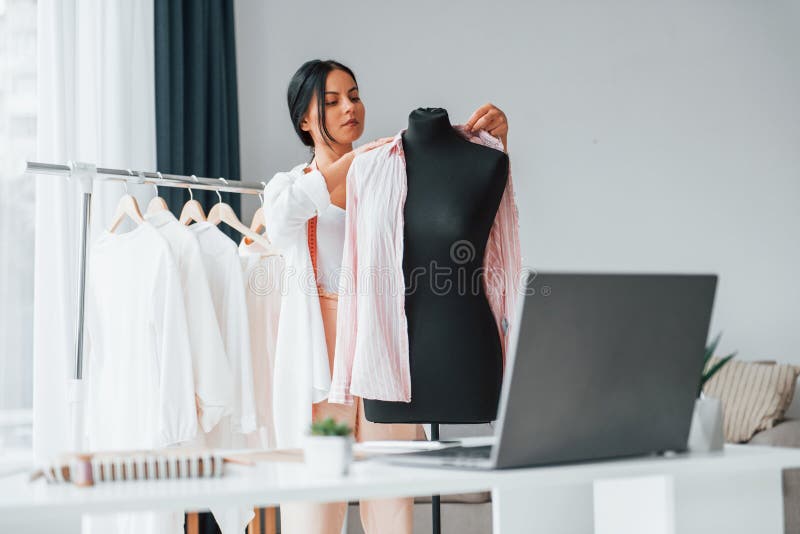 Choosing Clothes. Seamstress is in Her Office Stock Photo - Image of ...
