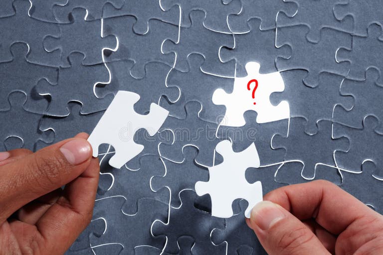 Choosing the Right Piece of Puzzle Stock Image - Image of holding ...