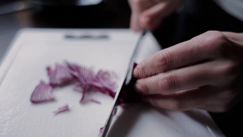 Chop the Red Onion on the Board on the Table Stock Video - Video of ...