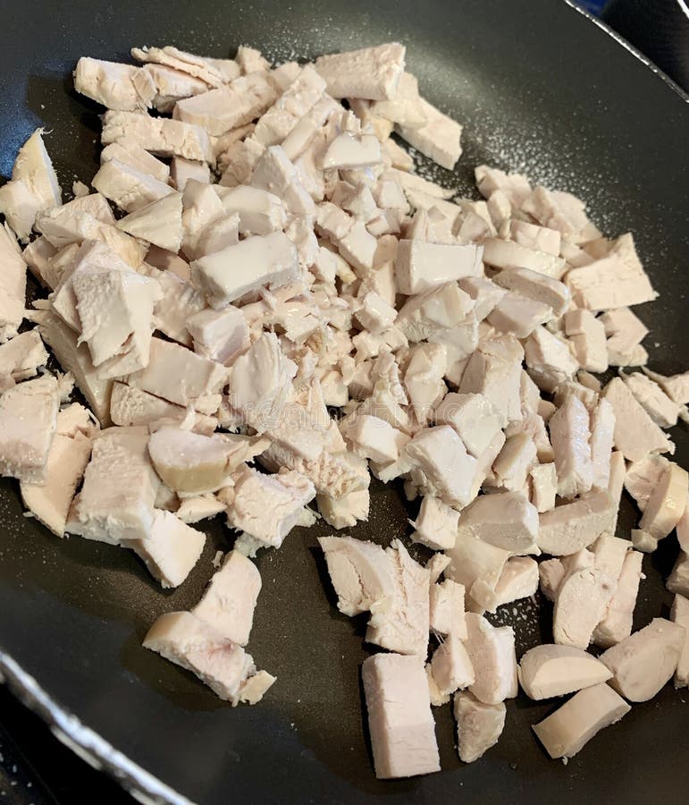 Chopped chicken in a pan stock photo. Image of chicken - 176601196