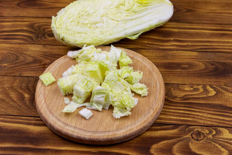 Chopped Chinese Cabbage on Cutting Board on Wooden Table Stock Photo ...
