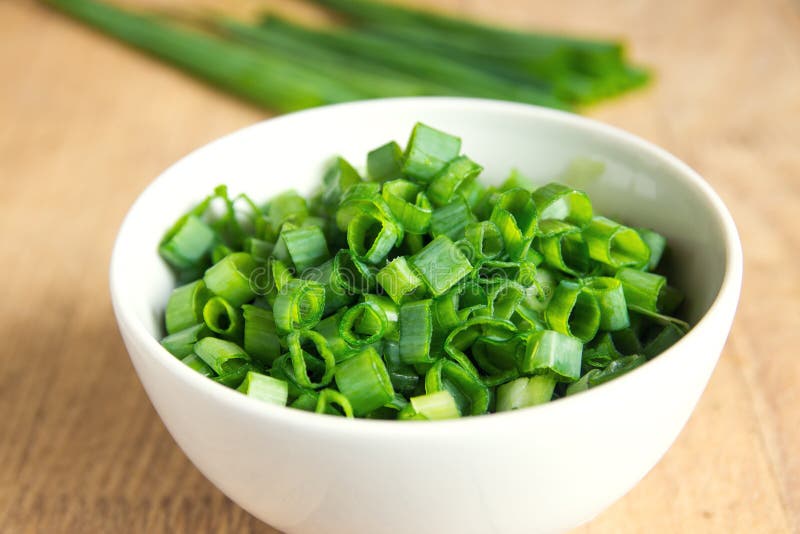 Chopped chives on wood stock image. Image of nutrients - 13644177