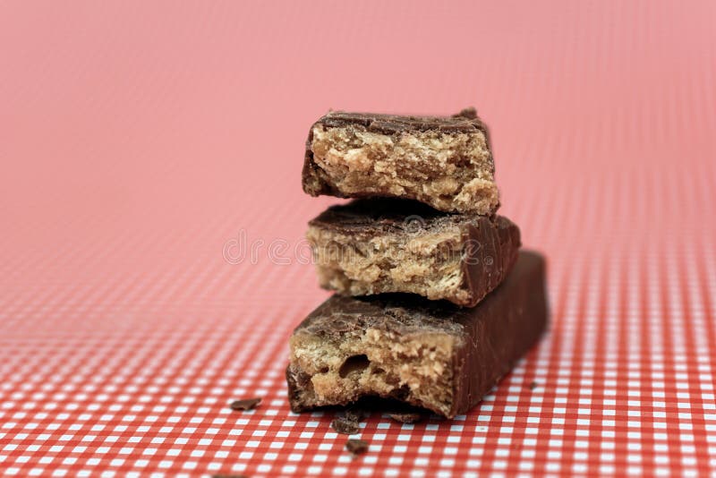 Chopped Chocolate Glazed Energy Protein Bar on Pink Background. Stock ...