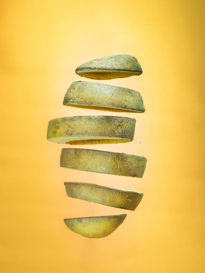 Chopped Floating Potato on Orange Background Stock Photo - Image of ...