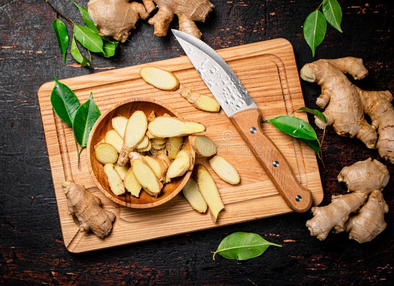 Chopped Ginger Root Cutting Block and Knife Top View Stock Photo ...
