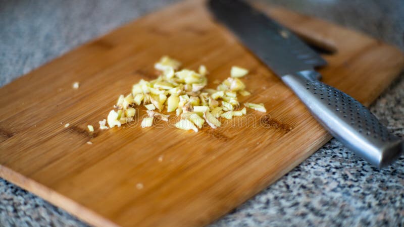 Chopped Ginger with Knife on Cutting Board Side View Stock Image ...