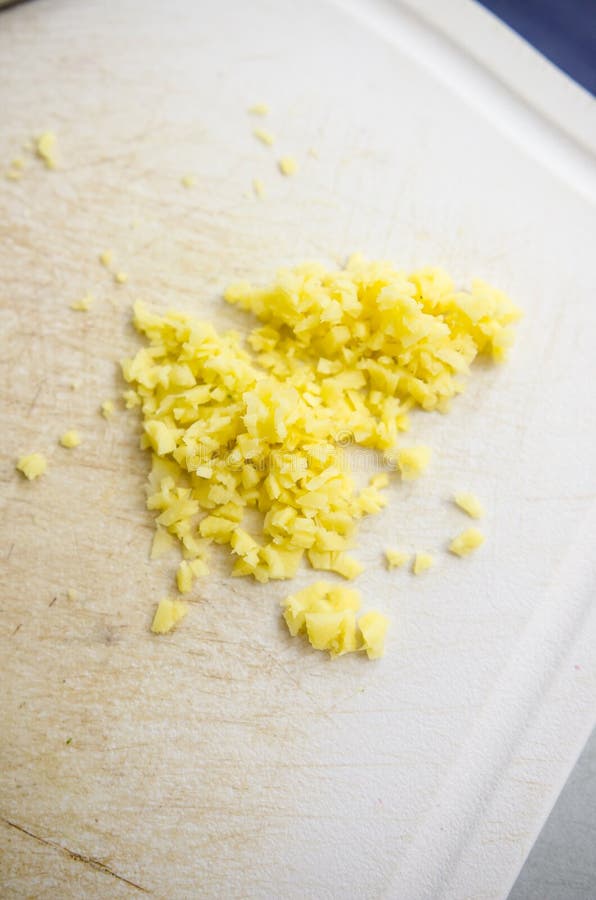Chopped Ginger Root Cutting Block and Knife Top View Stock Photo ...