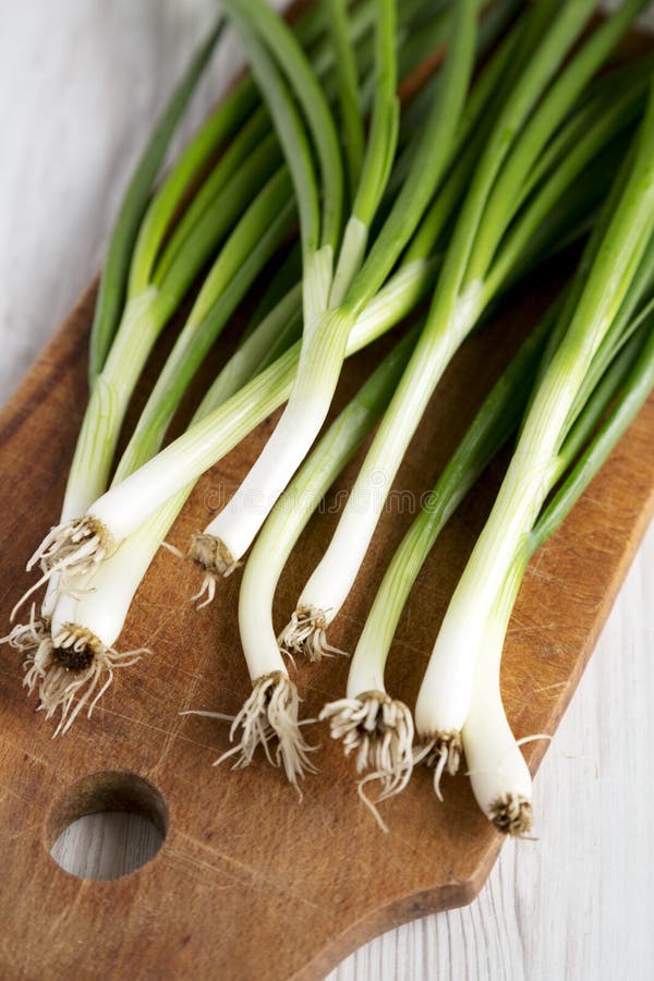 Chopped Green Onions on a Rustic Wooden Board, Low Angle View. Close-up ...
