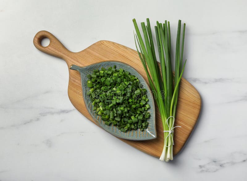 Chopped Green Spring Onion and Stems on White Marble Table, Top View ...