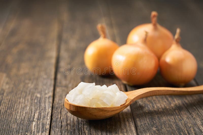 Chopped Onion in a Wooden Spoon on a Rustic Table, Copy Space for Text ...