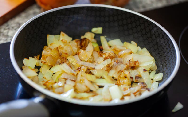 Chopped Onions are Fried in a Black Pan Stock Photo - Image of fried ...