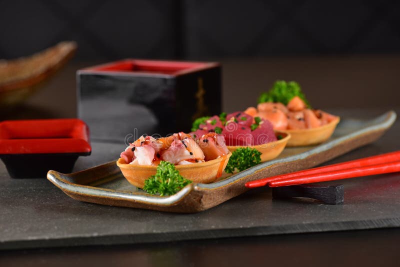 Canapes on rustic plate stock image. Image of oriental - 127155611