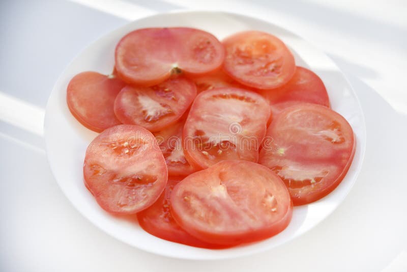 Chopped Tomato on a White Plate. Tomato Salad. Sliced Vegetables Stock ...