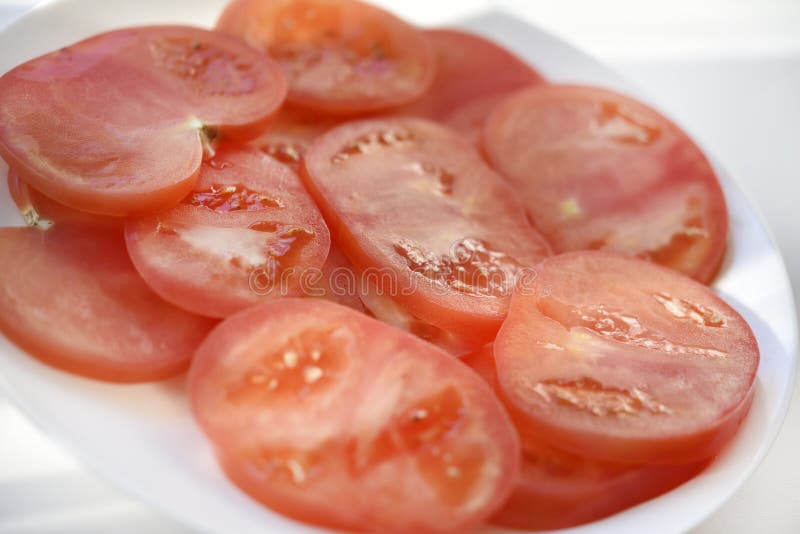 Chopped Tomato on a White Plate. Tomato Salad. Sliced Vegetables Stock ...