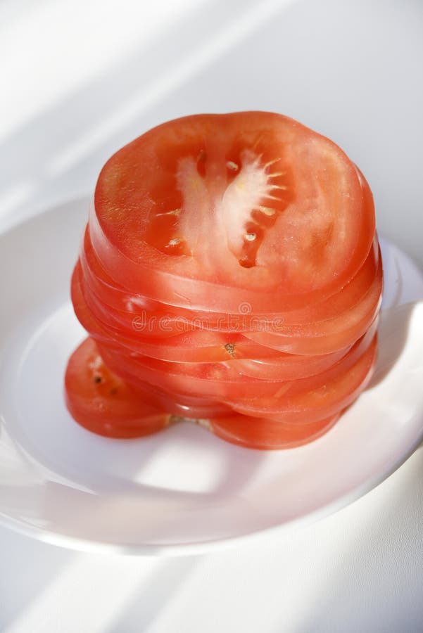Chopped Tomato on a White Plate. Tomato Salad. Sliced Vegetables Stock ...