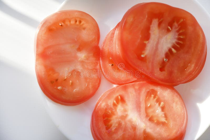 Chopped Tomato on a White Plate. Tomato Salad. Sliced Vegetables Stock ...
