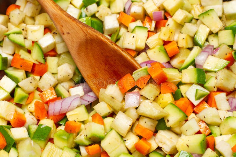 Chopped Vegetables and a Wooden Spoon in a Close Up View Stock Image ...