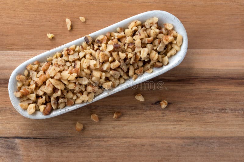 Chopped Walnuts in a Bowl stock image. Image of ingredient - 260535827