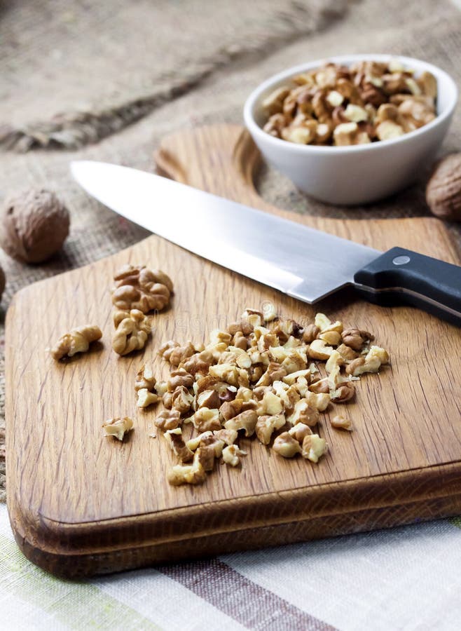 Chopped Walnuts on Wooden Board Stock Photo - Image of closeup, brown ...