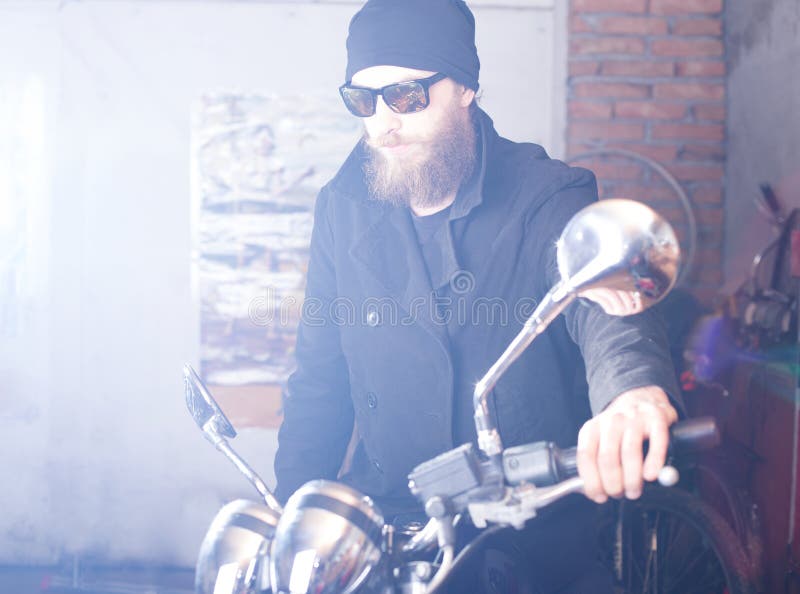 Chopper with its driver stock image. Image of motor, bearded - 51256059