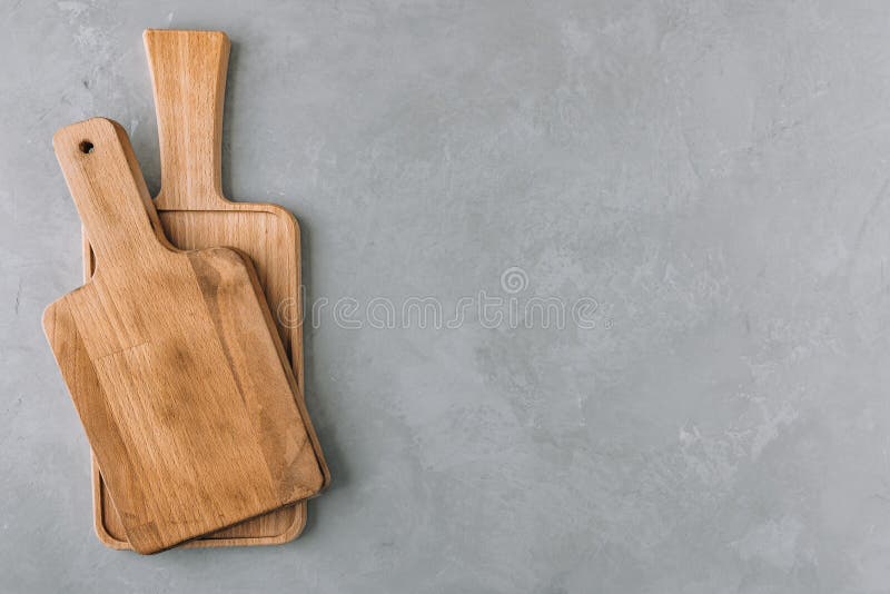 Wooden Chopping Board on Dark Stone Background, Top View Stock Image ...