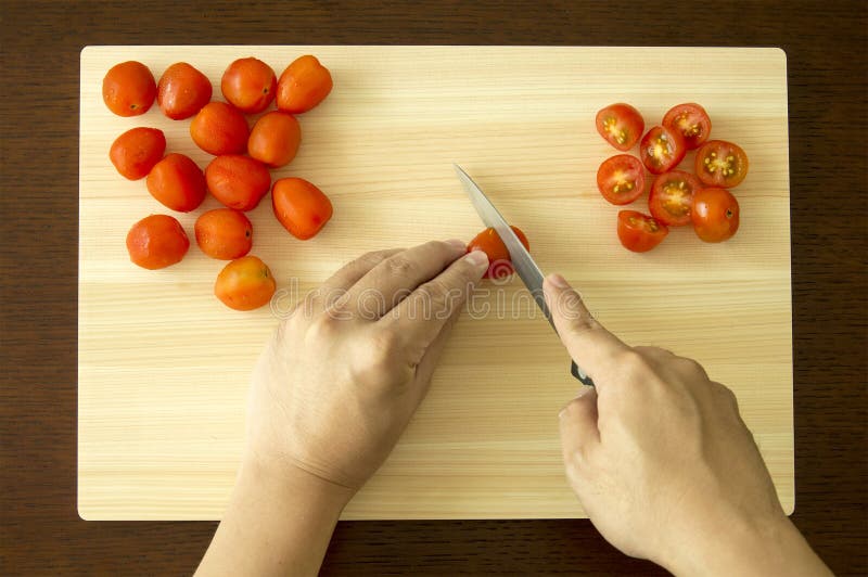 Chopping Cherry Tomato on Cutting Board Stock Photo - Image of salad ...
