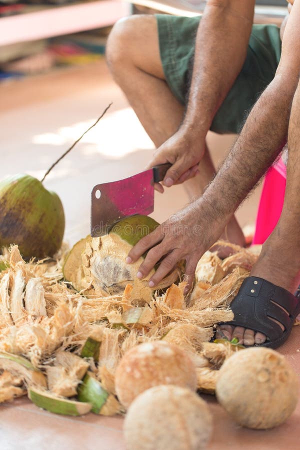 Chopping coconut by knife stock image. Image of chop - 52266217
