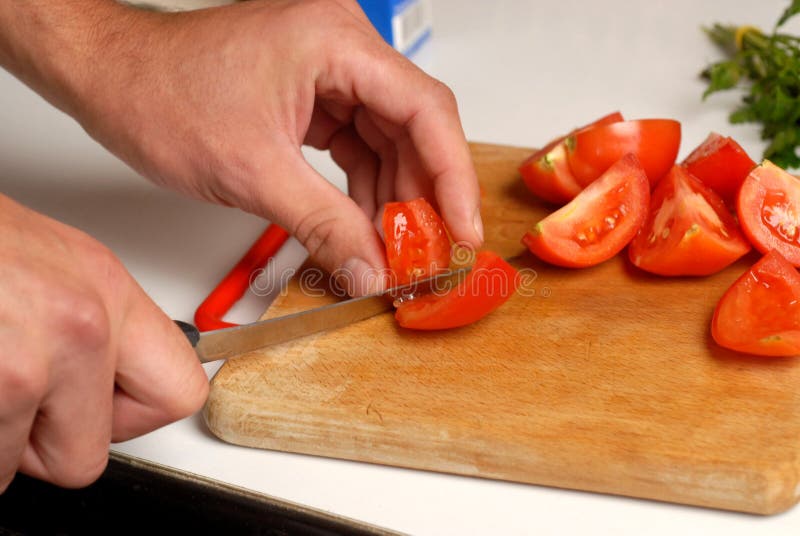 Chopping Fresh Tomato on the Kitchen Table Stock Image - Image of ...