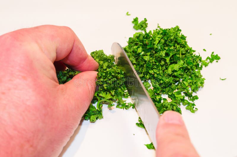 Chopping parsley stock image. Image of slicing, background - 55943209
