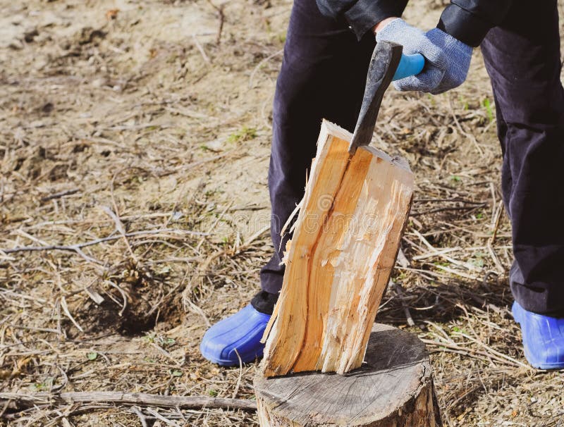 Chopping wood with an ax stock photo. Image of outdoors - 168334018