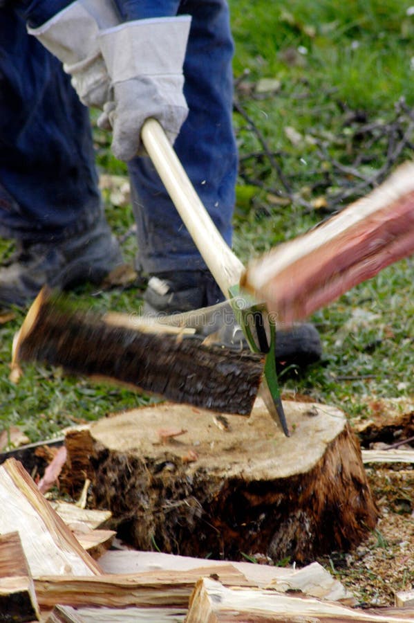 Chopping wood with an axe stock photo. Image of commercial - 189097358