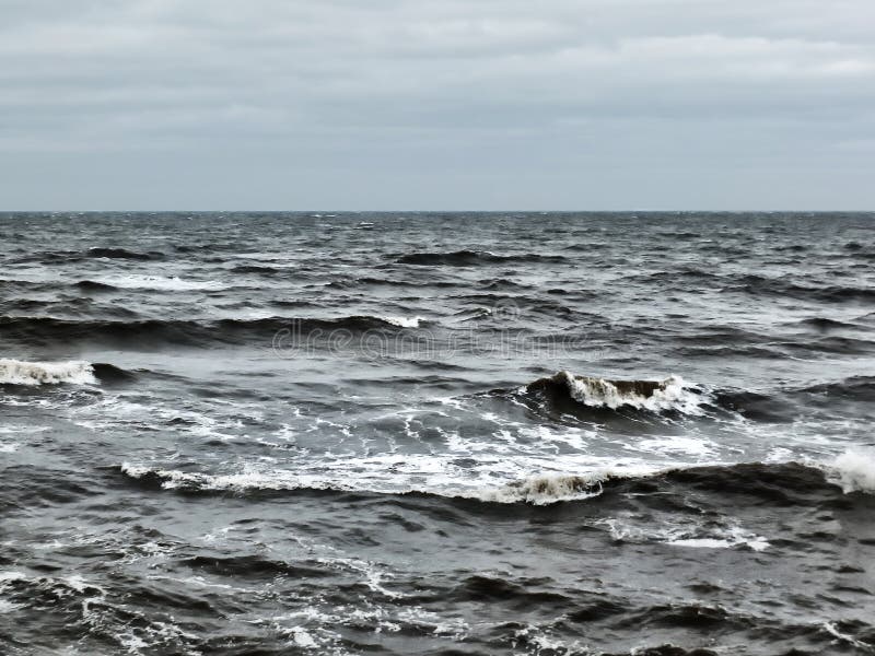 Choppy Atlantic Ocean Waves with Surf and Grey Winter Clouds Stock ...
