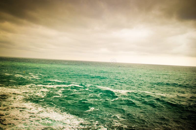 Choppy Seas and the Horizon Stock Photo - Image of mountains, tree ...