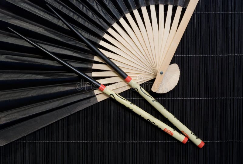 Chopsticks and fan stock photo. Image of black, slats - 4818872