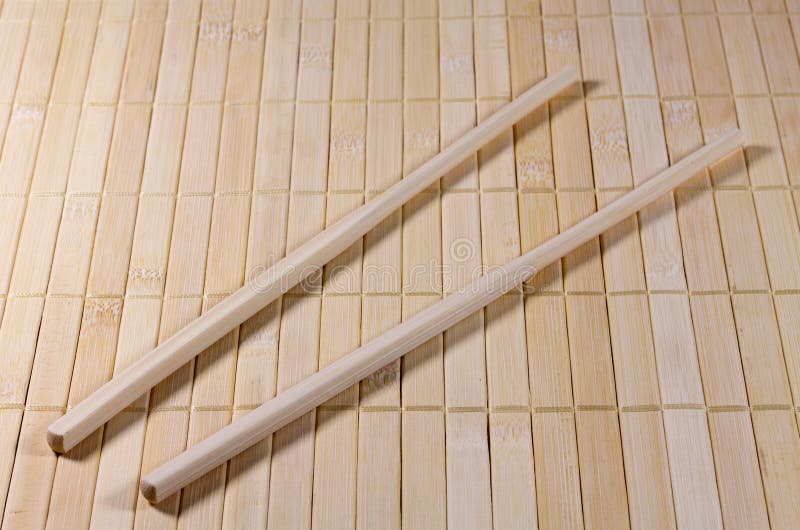Chopsticks on a straw matt stock image. Image of wicker - 37221189