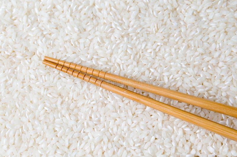 Chopsticks on Top of Rice Backgound Stock Image - Image of cuisine ...
