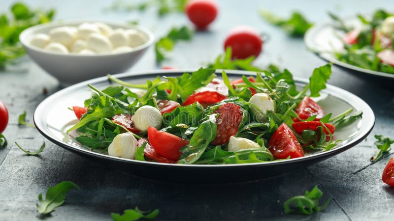 Chorizo Salad with Cherry Tomatoes, Mozzarella and Wild Rucola Stock ...