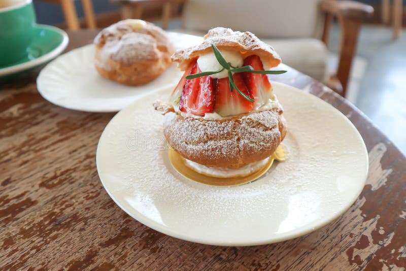 Choux Cream or Cream Puff, Eclair or Strawberry Choux Cream and Coffee ...
