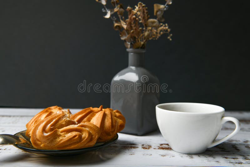 Choux Pastry on a Dark Background. Choux Pastry Eclair with Custard ...