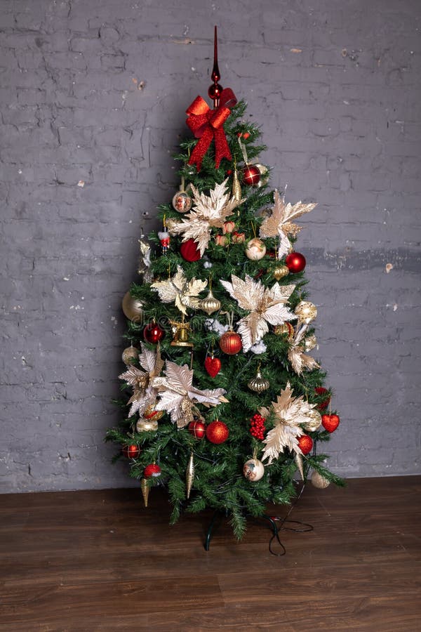 Chrismass Tree with Red Bals and Bow in Fornt of Bricks Wall Stock ...