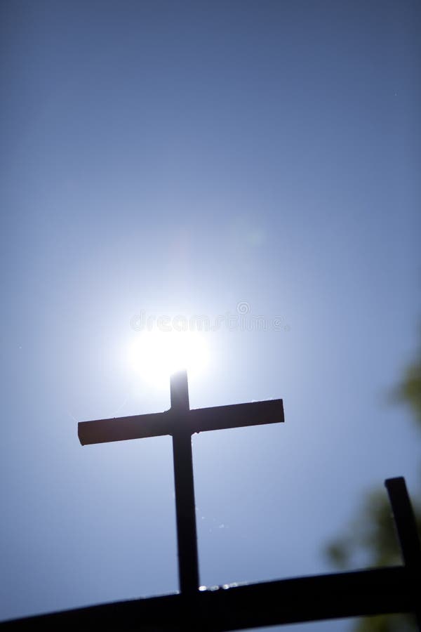 Christian Cross Back Lit Blue Sky Stock Photo - Image of book, holiday ...
