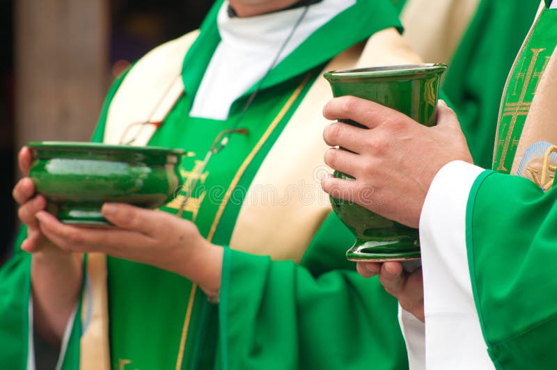 Christian Priests Holding Bowls of Wafer and Wine Stock Photo - Image ...
