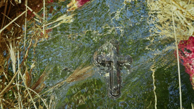 Christian Symbol Cross on Holy Water and Reflection of Tree Leaves and ...