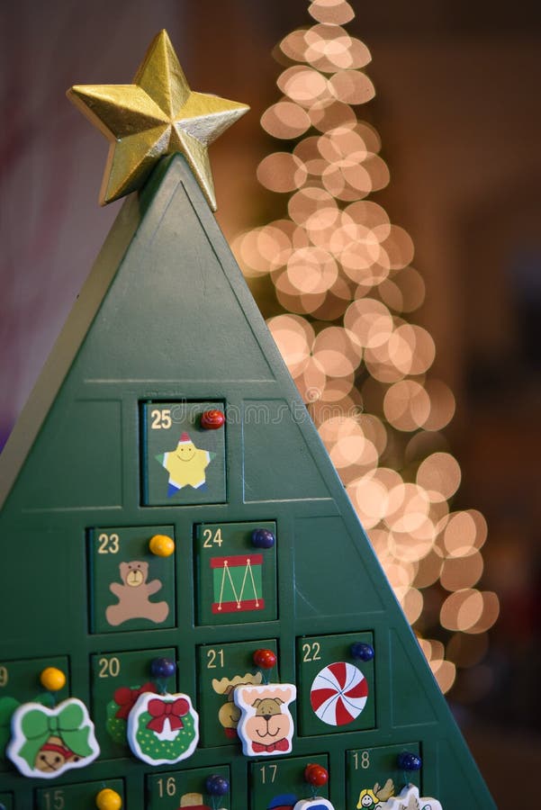 Christmas Advent Tree Against a Tree of Lights Stock Image - Image of ...