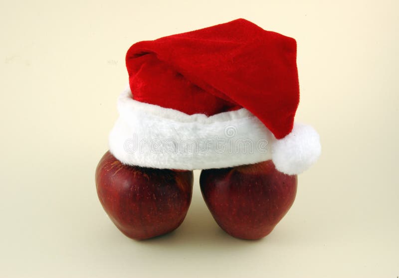 Christmas Apples with Santa Hat on a White Background. Stock Photo ...