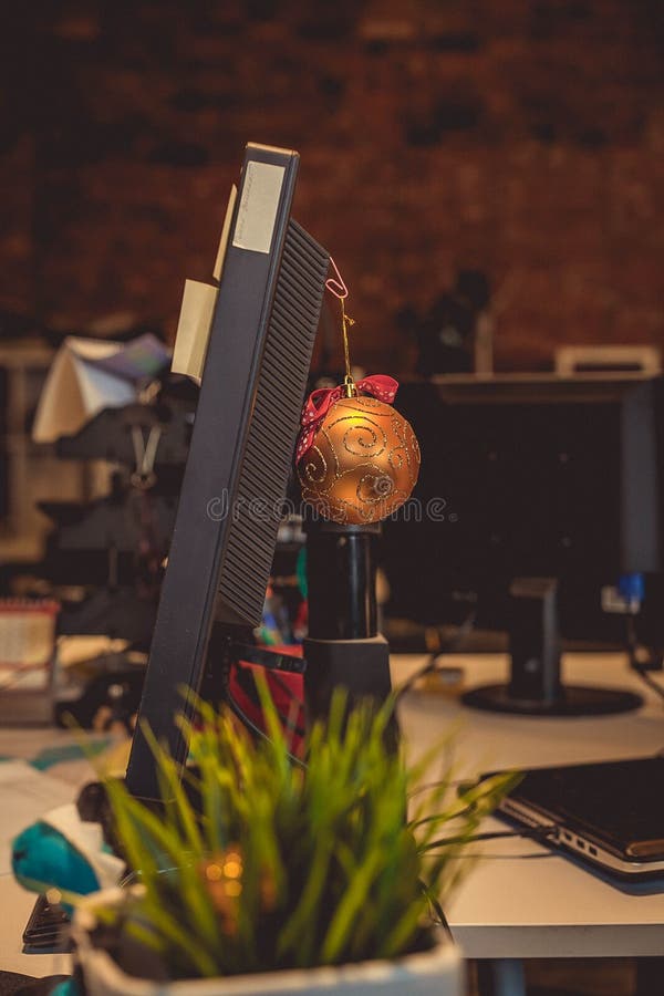 Christmas Ball Hanging on a Computer Monitor in the Office Stock Photo ...