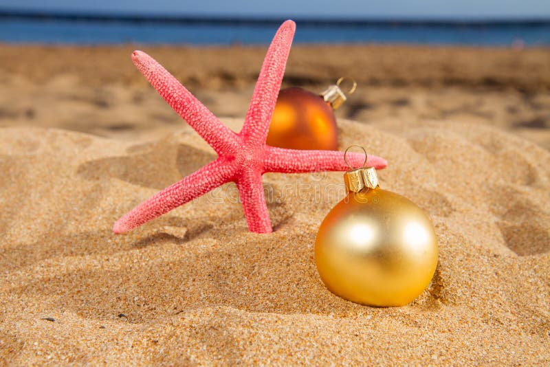 Christmas Balls with Starfush on Beach Stock Photo - Image of closeup ...