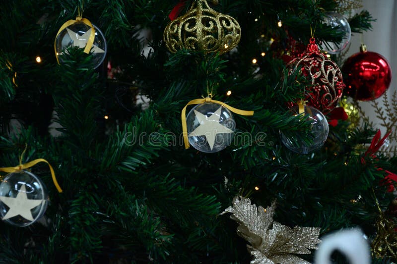 Christmas Balls of Various Types and Colors on a Green Tree with Stars ...